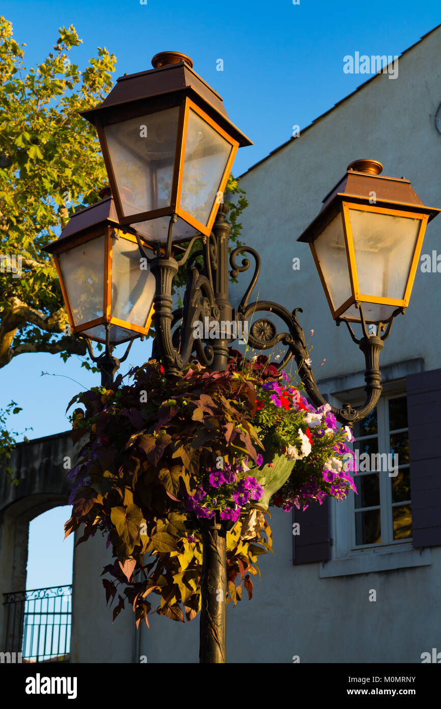 French style old vintage iron with glass street light in small village ...