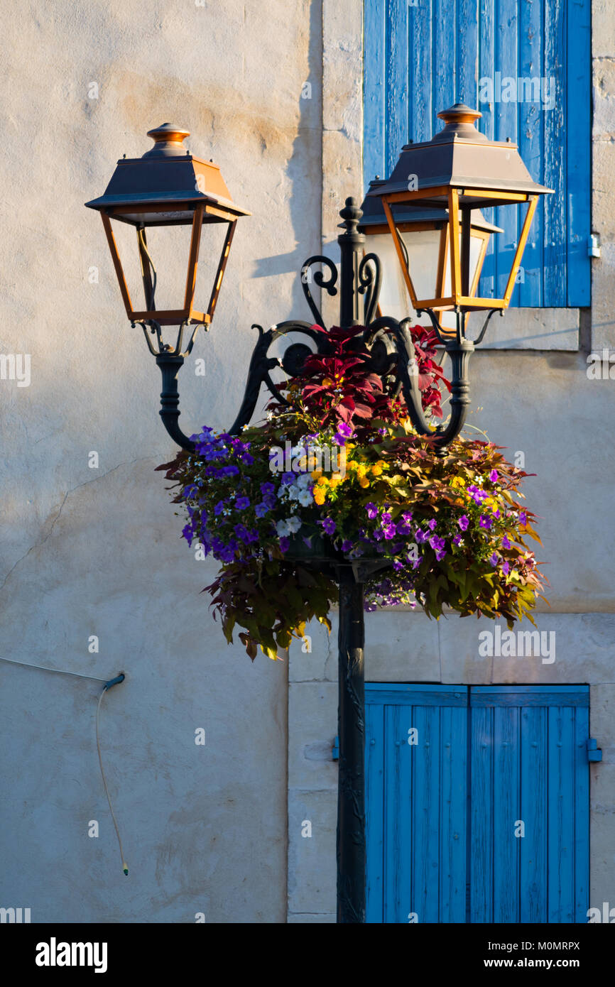 French style old vintage iron with glass street light in small village ...