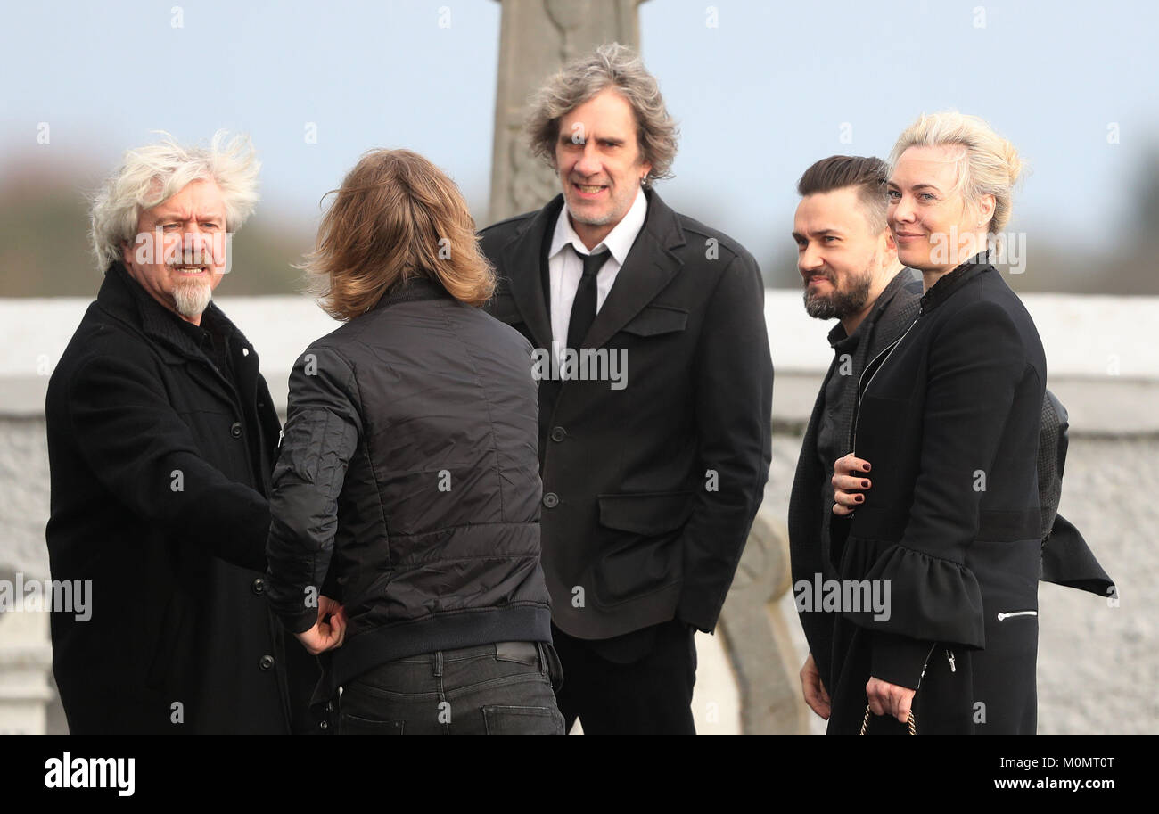 Band member Mike Hogan (second right) and his wife Siobhan arrive for ...
