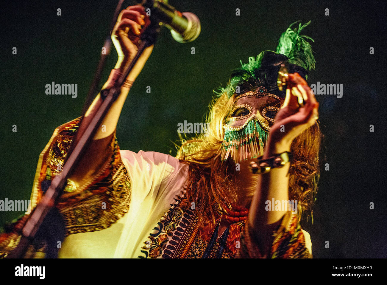 A masked singer wears colourful clothing as part of the Swedish fusion ...