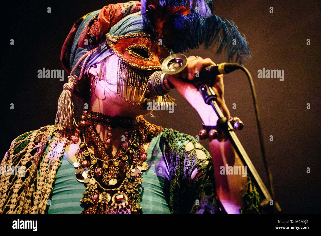 A masked singer wears colourful clothing as part of the Swedish fusion ...