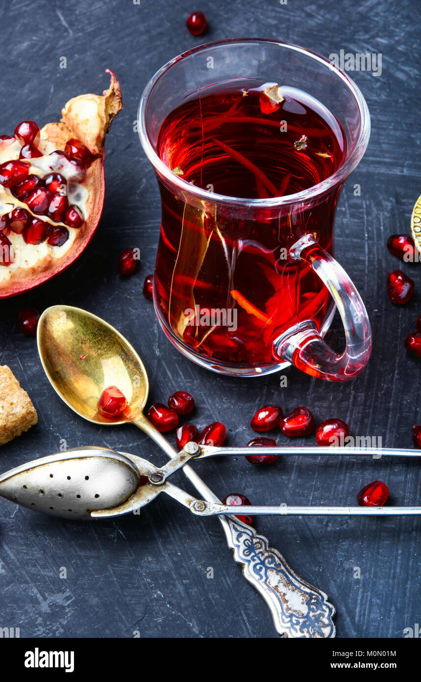 Cupful with turkish winter tasty tea with pomegranate Stock Photo - Alamy