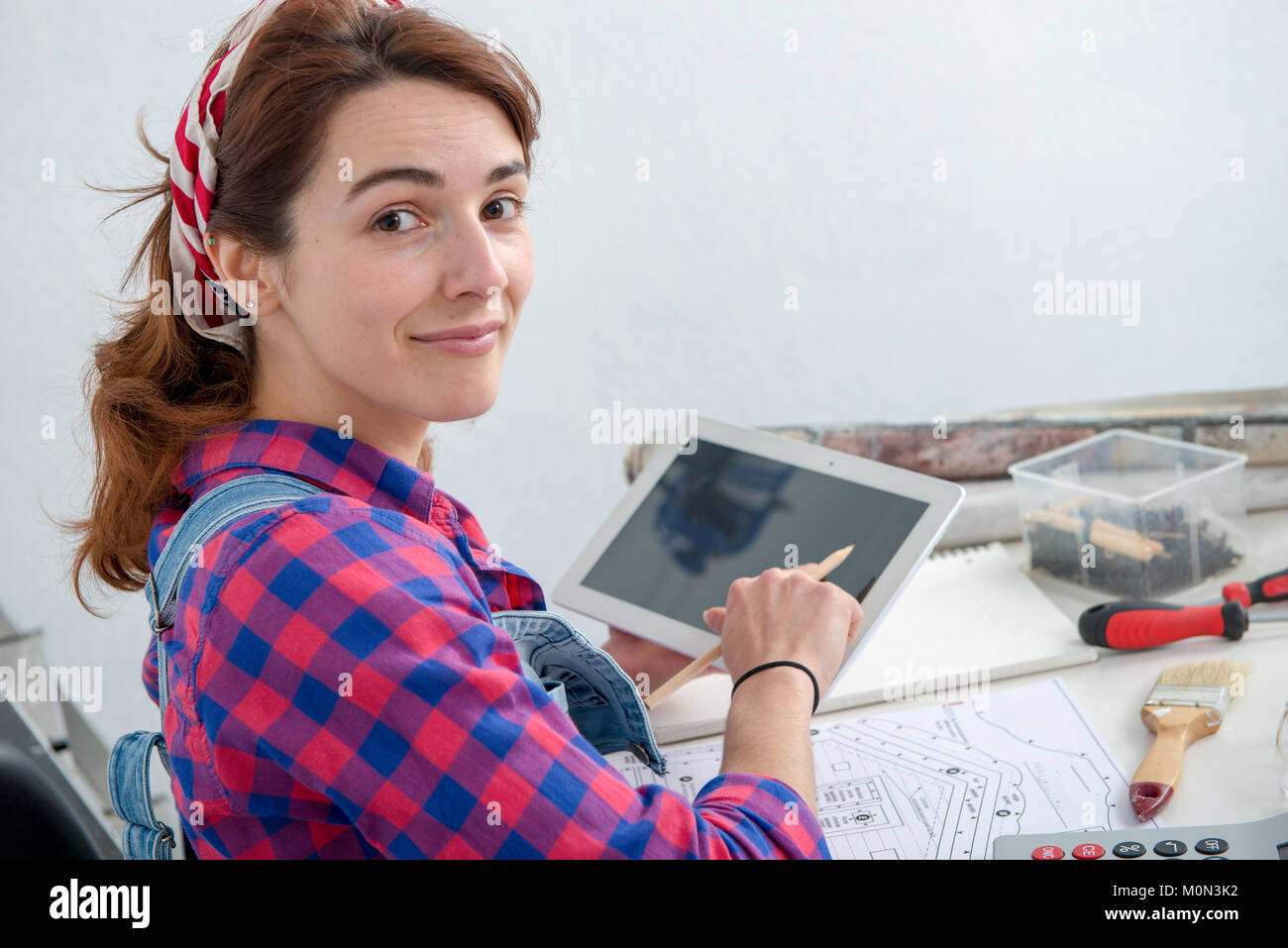 young woman interior designer using a digital tablet Stock Photo - Alamy
