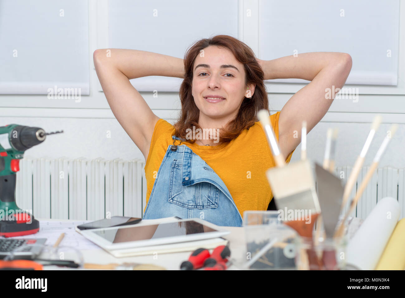 a pretty young woman doing DIY work at home Stock Photo - Alamy