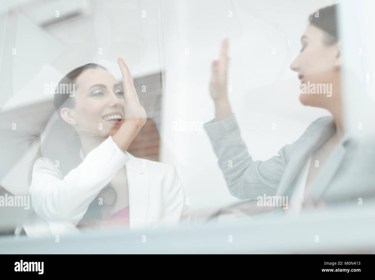 behind the glass. winning business team Stock Photo - Alamy