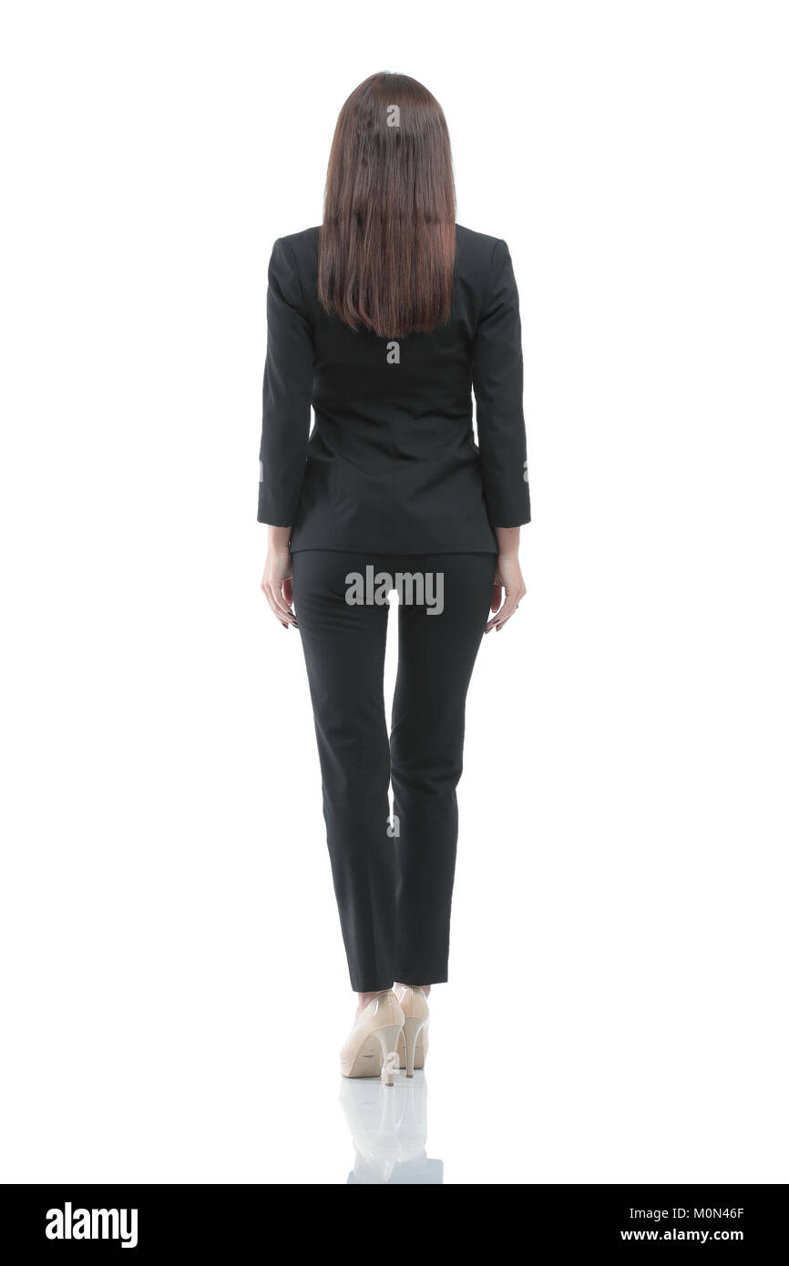rear view.full-length portrait of a young business woman in a pant suit ...