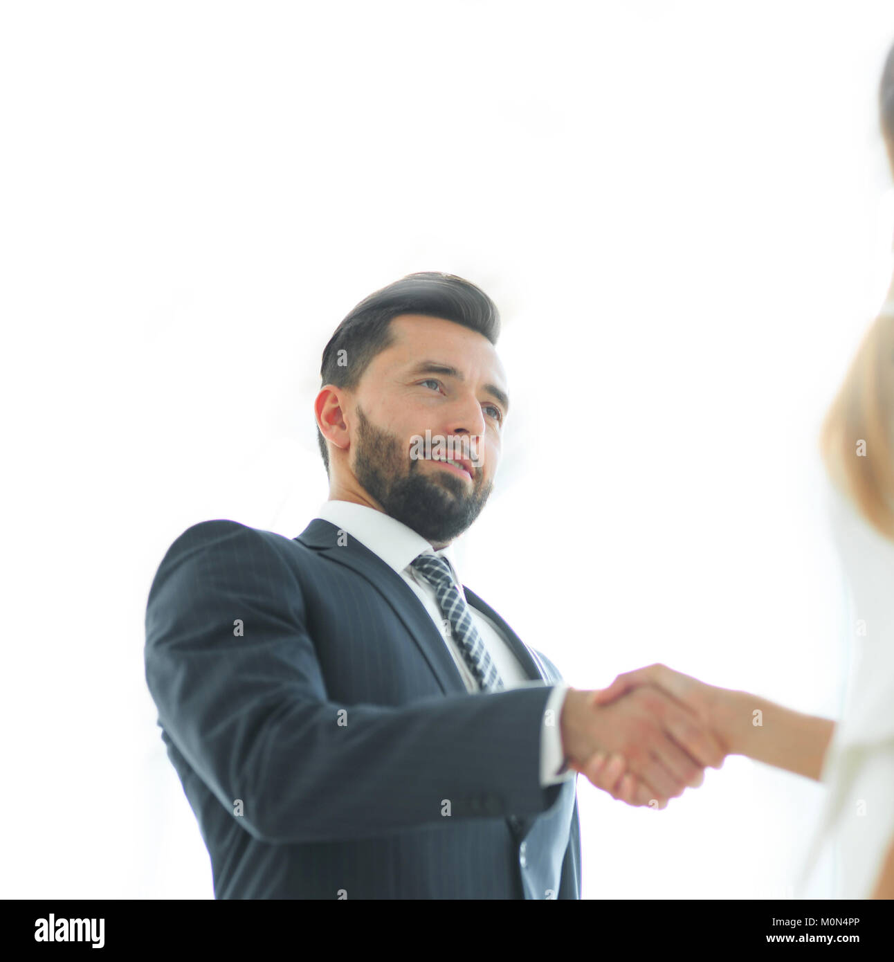 Two business workers shake hands in office Stock Photo - Alamy