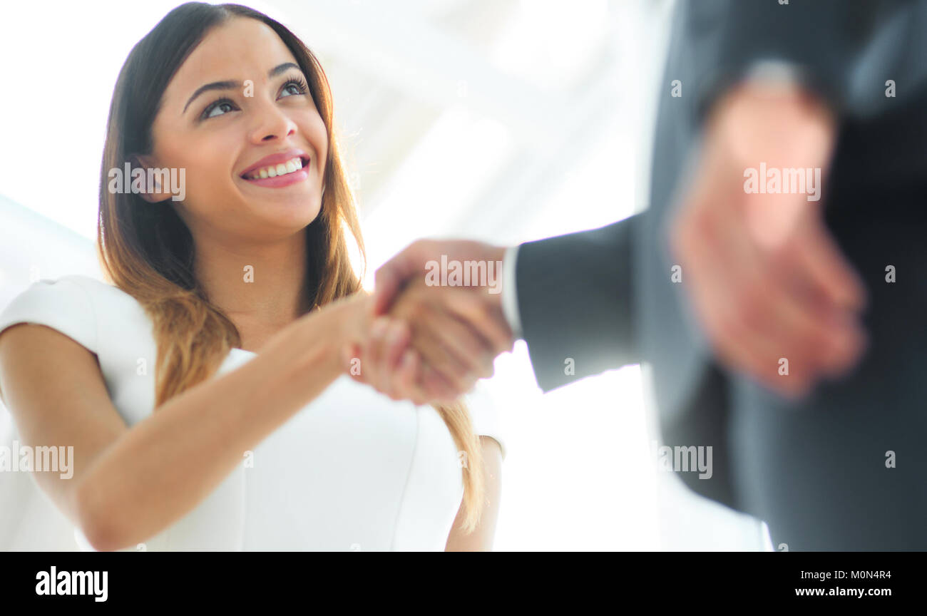 Business woman shaking hand to her partner Stock Photo - Alamy