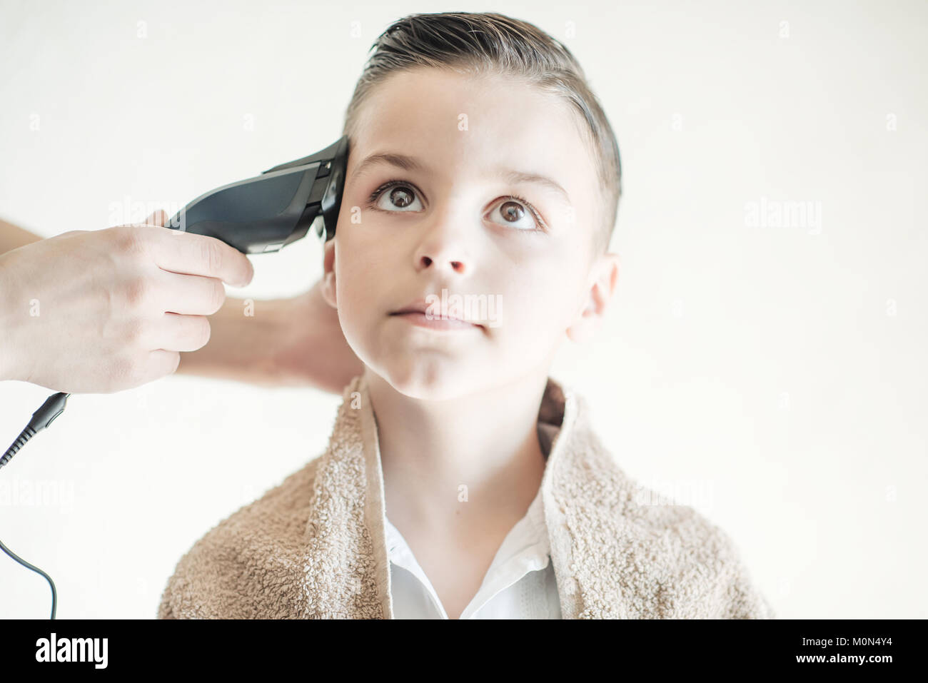 Hair cut boy blond scissors hi-res stock photography and images - Alamy