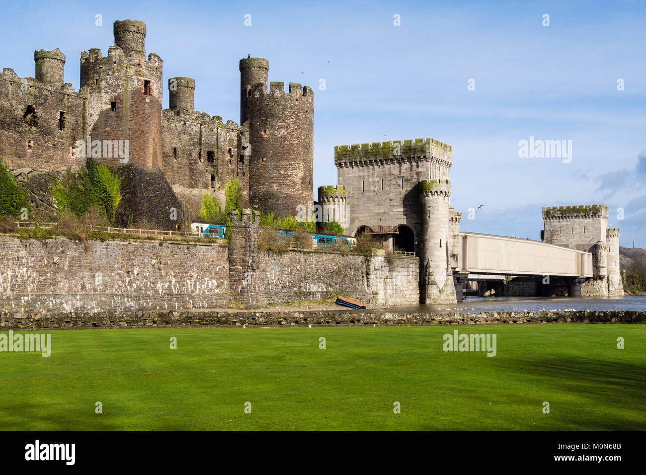 Arriva train passing Conwy castle from Robert Stephenson's tubular rail ...