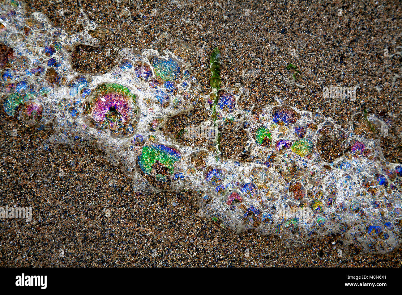 Colourful bubbles on sandy beach Stock Photo - Alamy