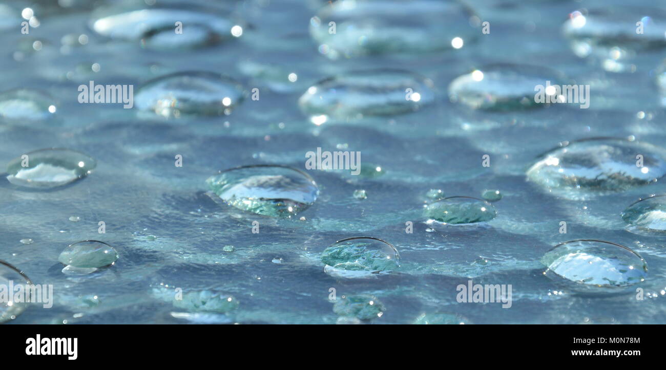 water drop roll on table Stock Photo - Alamy