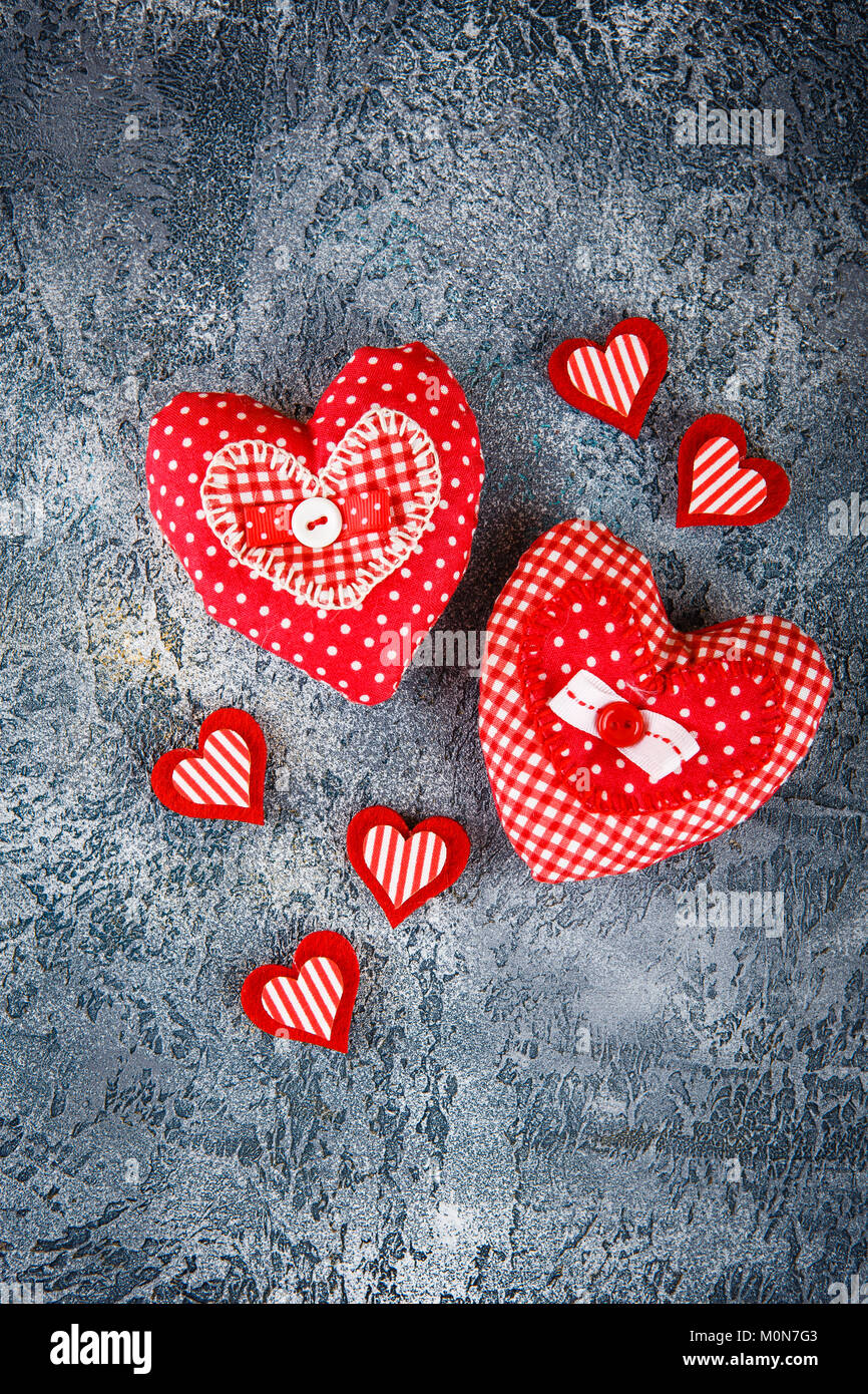 Two decorative handmade textile heart for Valentines day on grey ...