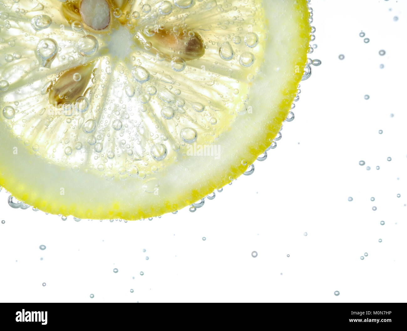 Lemon drop in fizzy sparkling water, juice refreshment Stock Photo - Alamy