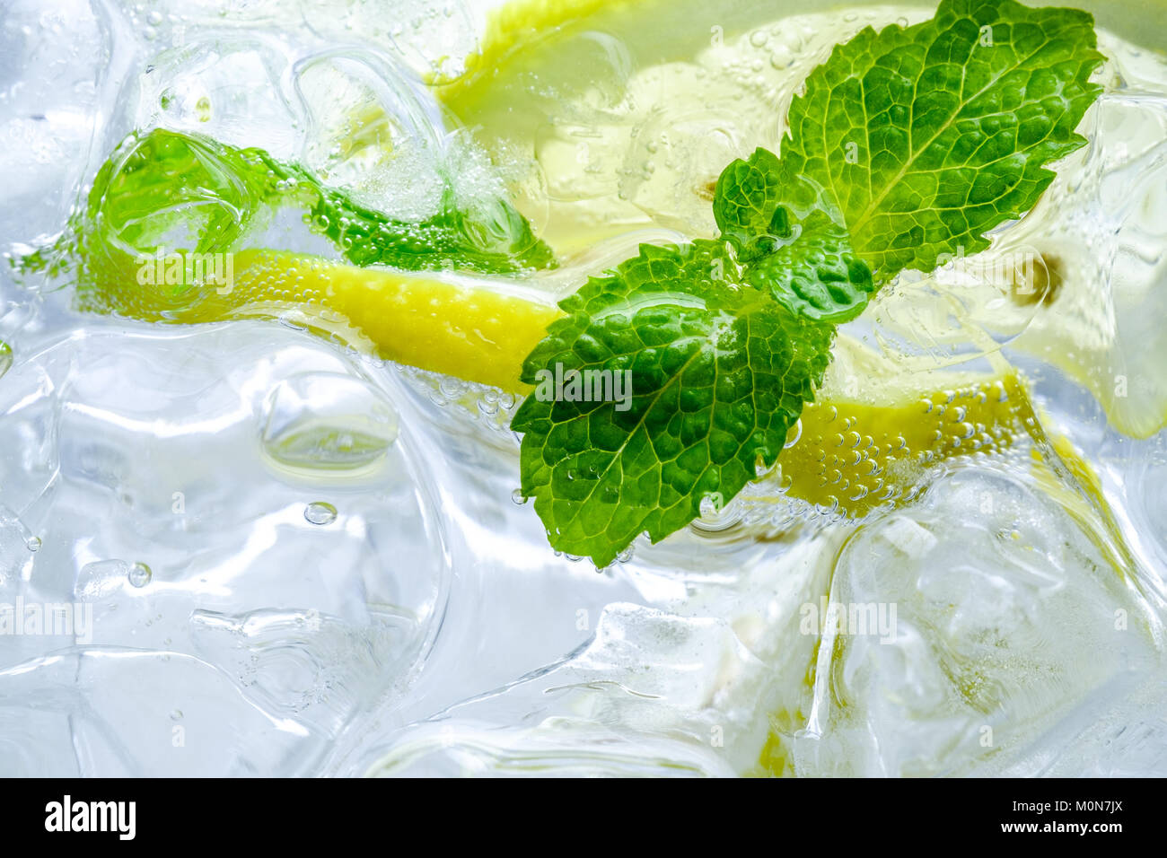 Lemon drop in fizzy sparkling water, juice refreshment Stock Photo - Alamy