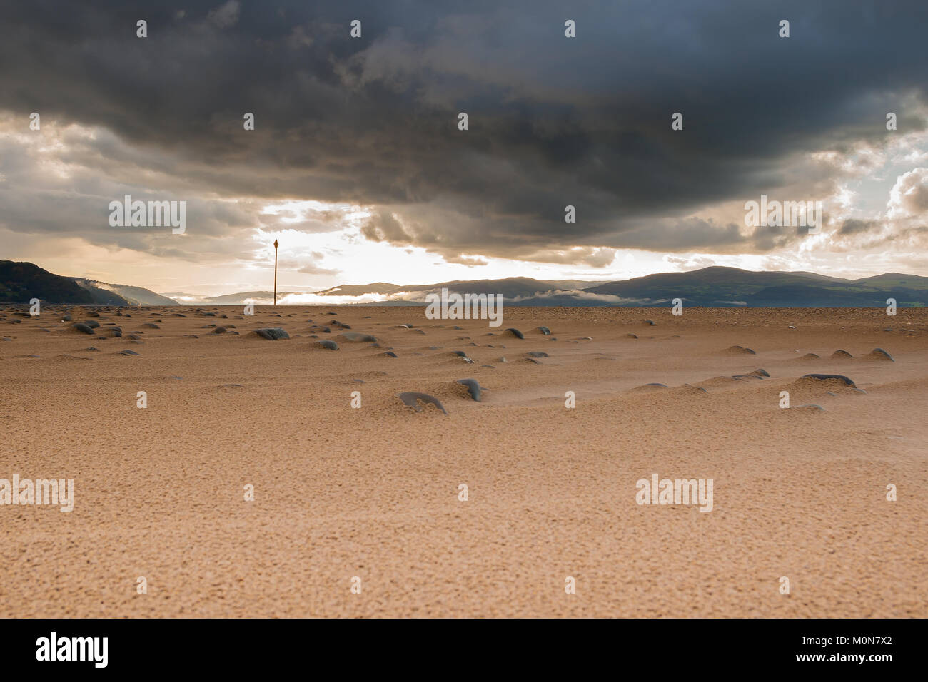 Dark nimbus storm clouds make a foreboding appearance in the sky over ...