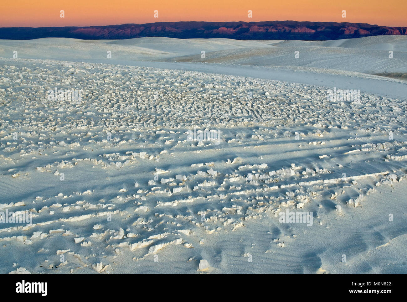 Cemented sand crust at dunes in Alkali Flat Trail area after sunset in ...