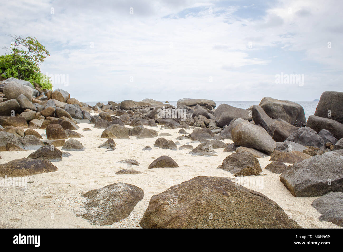 Big Rocks on the Beach Sand Stock Photo - Alamy