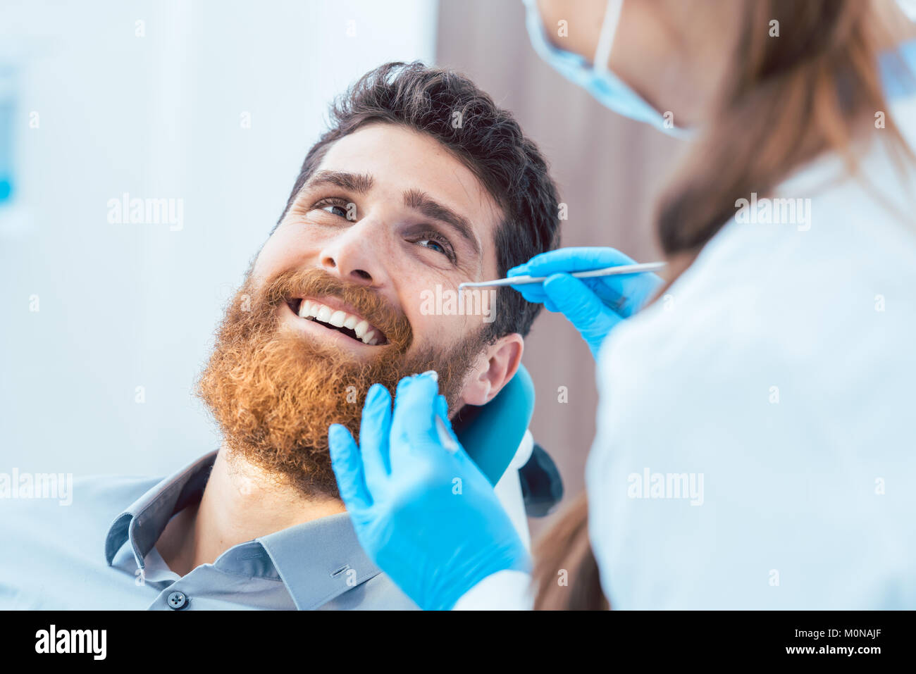 Reliable dentist using sterile instruments while cleaning the te Stock ...