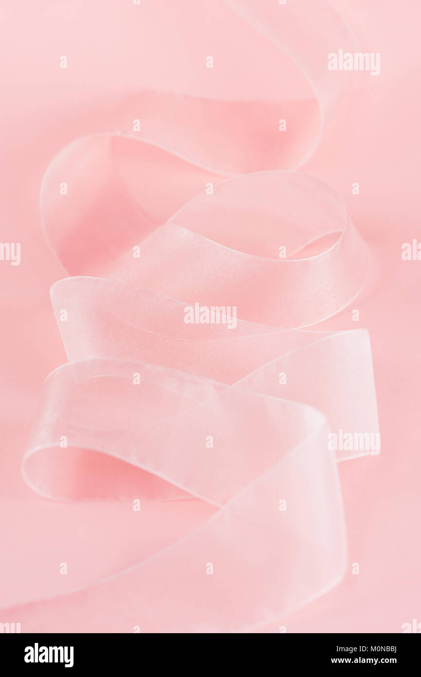 Gentle powder-pink background with ribbon, copy space Stock Photo - Alamy