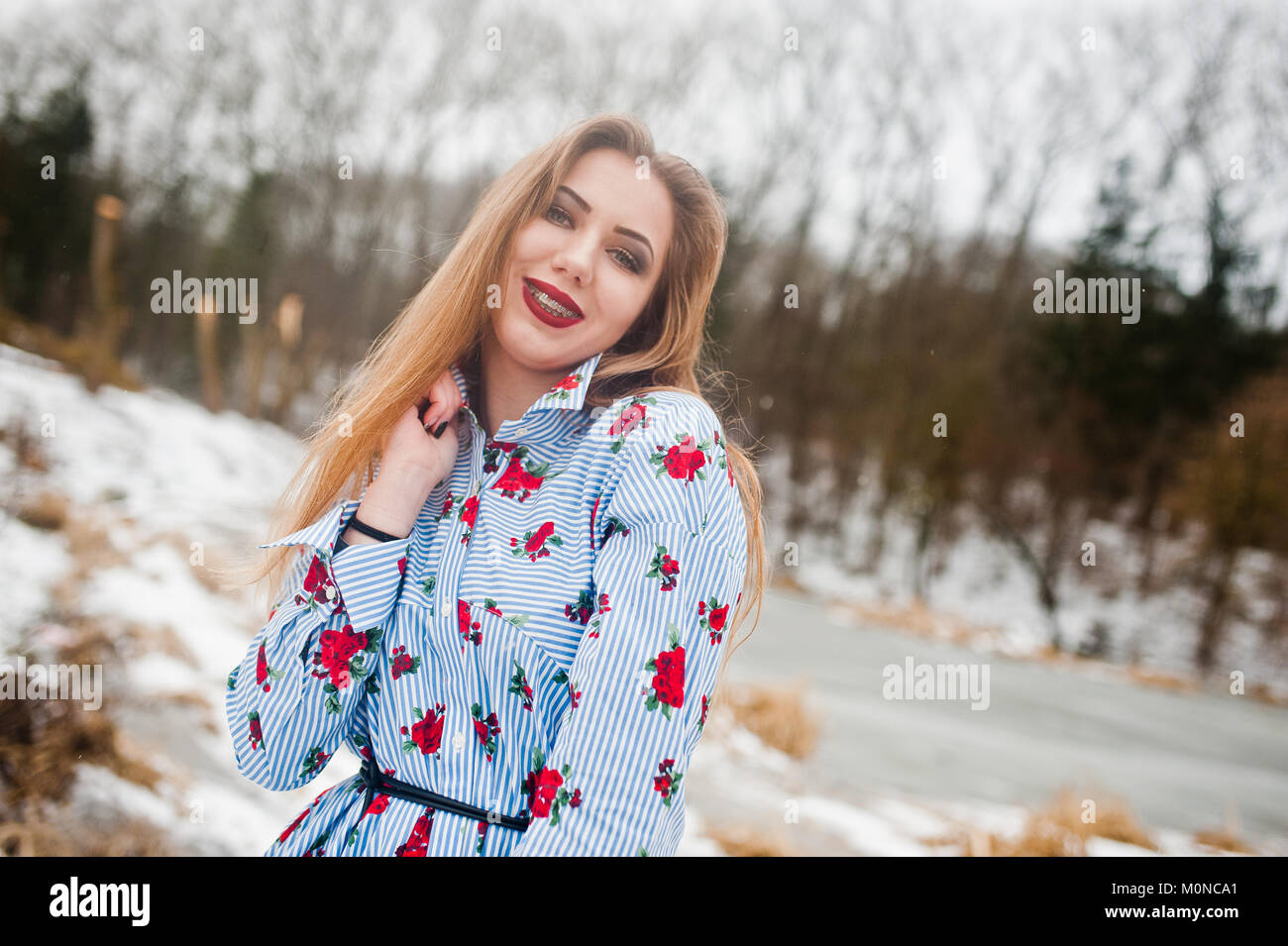 Girl with braces at winter day against frozen lake Stock Photo - Alamy