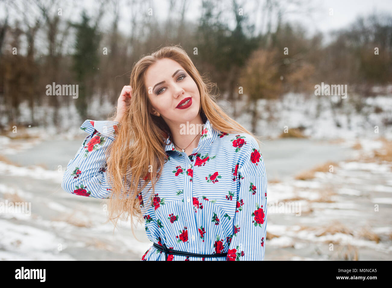 Girl with braces at winter day against frozen lake Stock Photo - Alamy