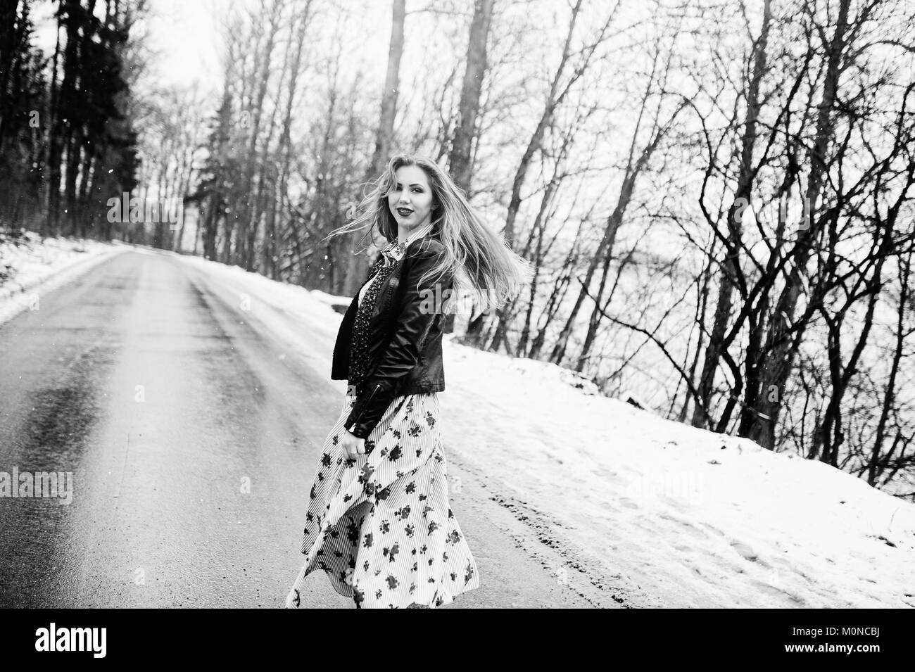 Stylish girl in leather jacket at winter day on road Stock Photo - Alamy