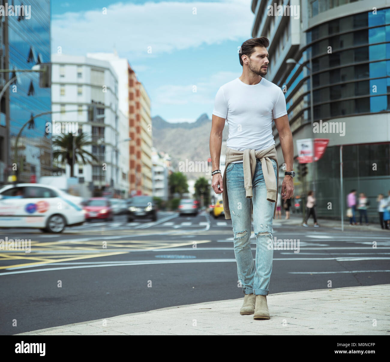 Portrait of an elegant, young man walking in the downtown Stock Photo ...