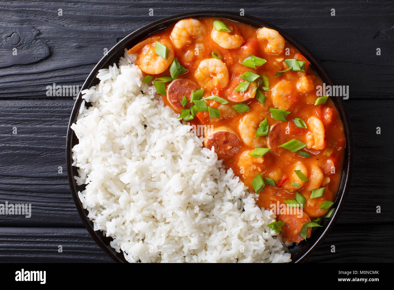 Traditional Louisiana gumbo with shrimp, sausage and rice macro on a ...