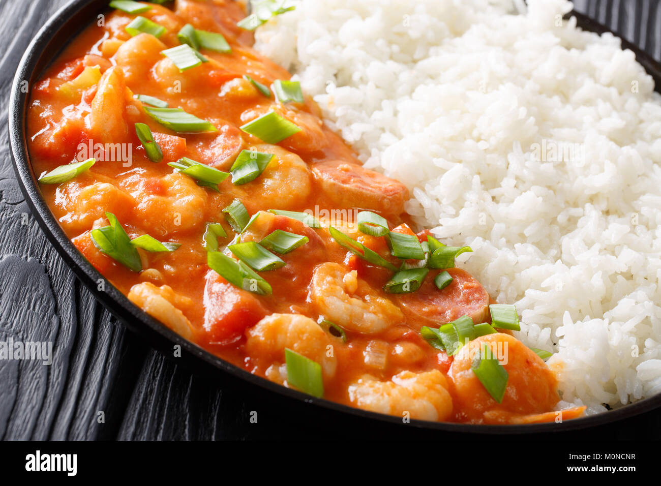 Traditional Louisiana gumbo with shrimp, sausage and rice macro on a ...