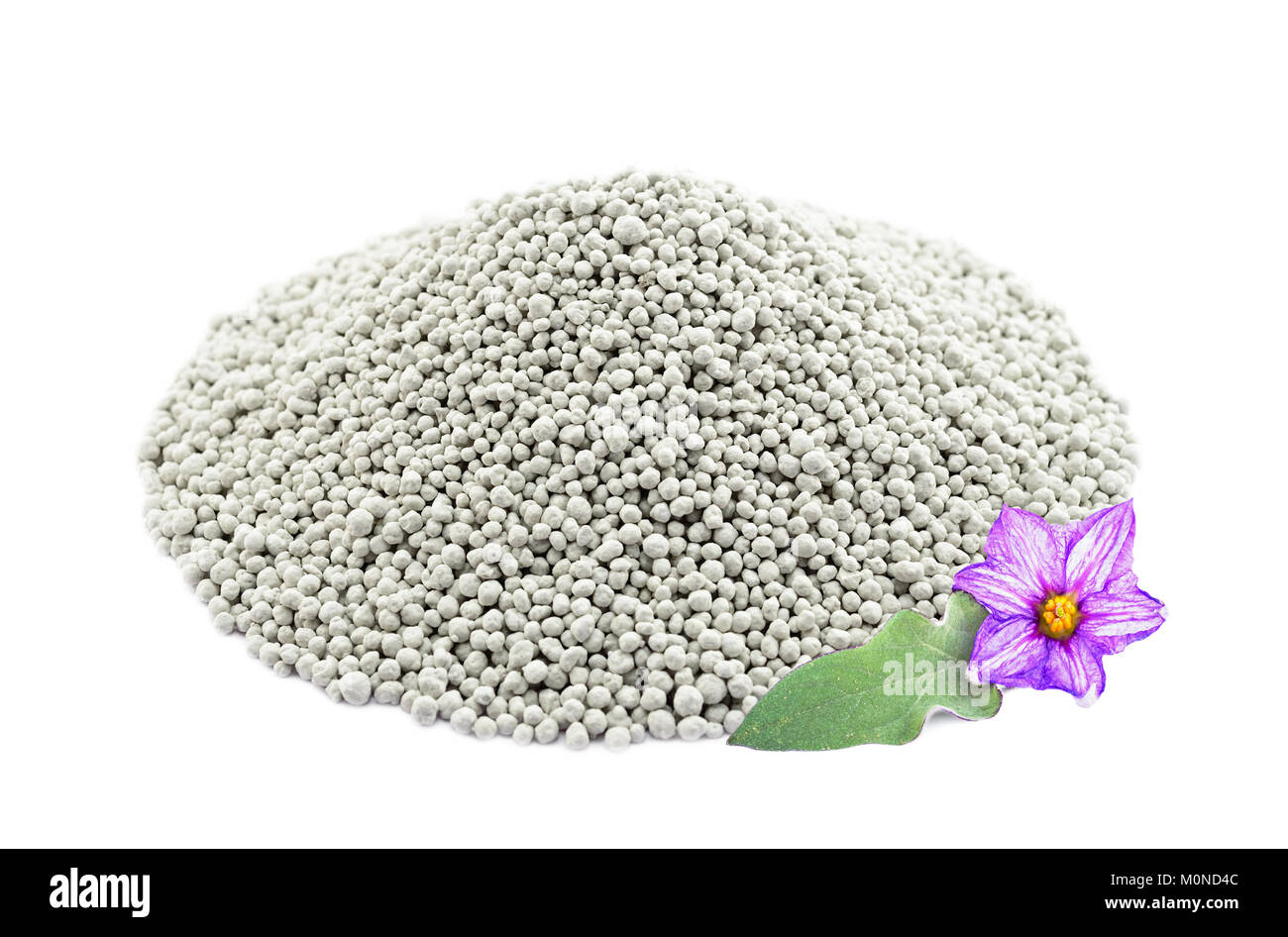 Heap of composite mineral fertilizers with leaf and flower, isolated on ...