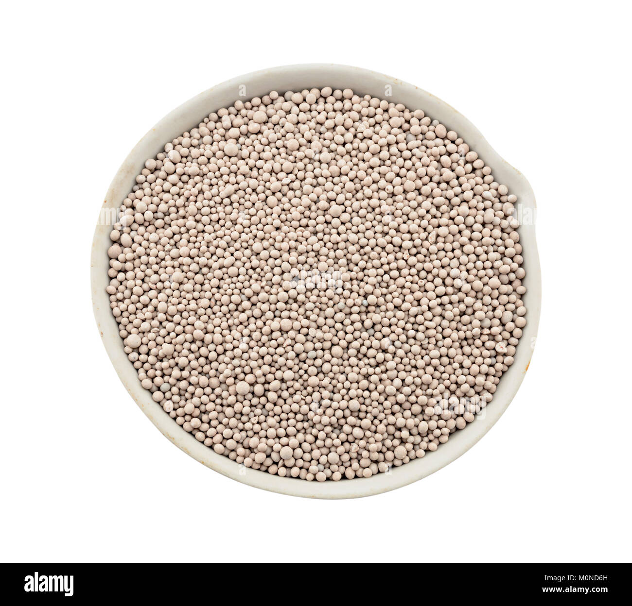 Composite mineral fertilizers in a chemical porcelain cup, isolated on ...