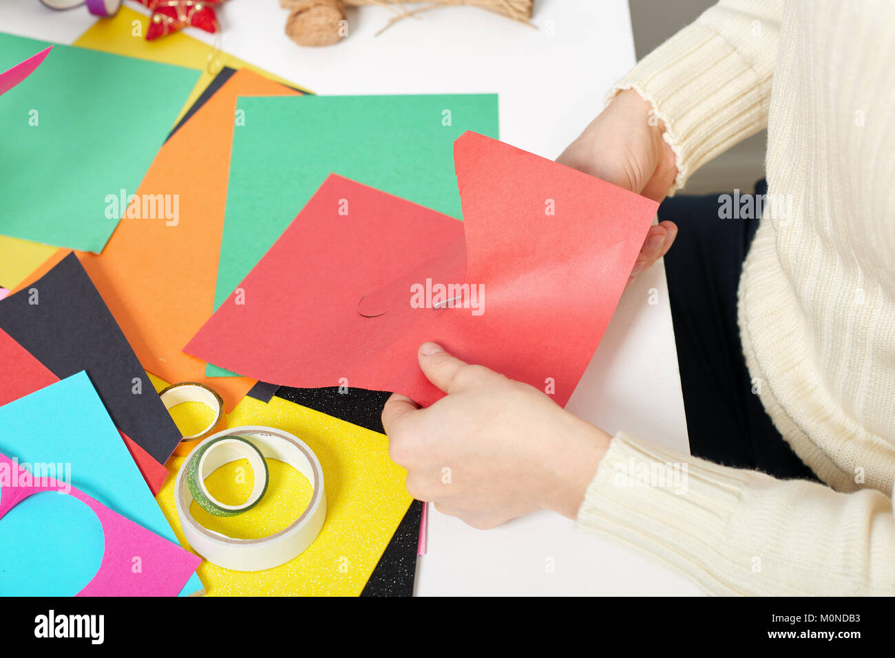 young couple making origami decorations for Valentine day, top view ...