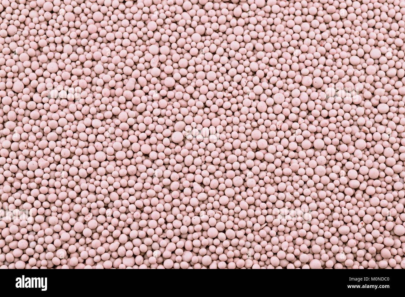 Pink composite mineral fertilizers granules. Background Stock Photo - Alamy