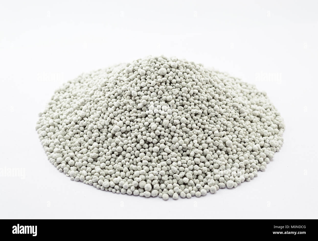 Heap of mineral fertilizers on the white background Stock Photo - Alamy