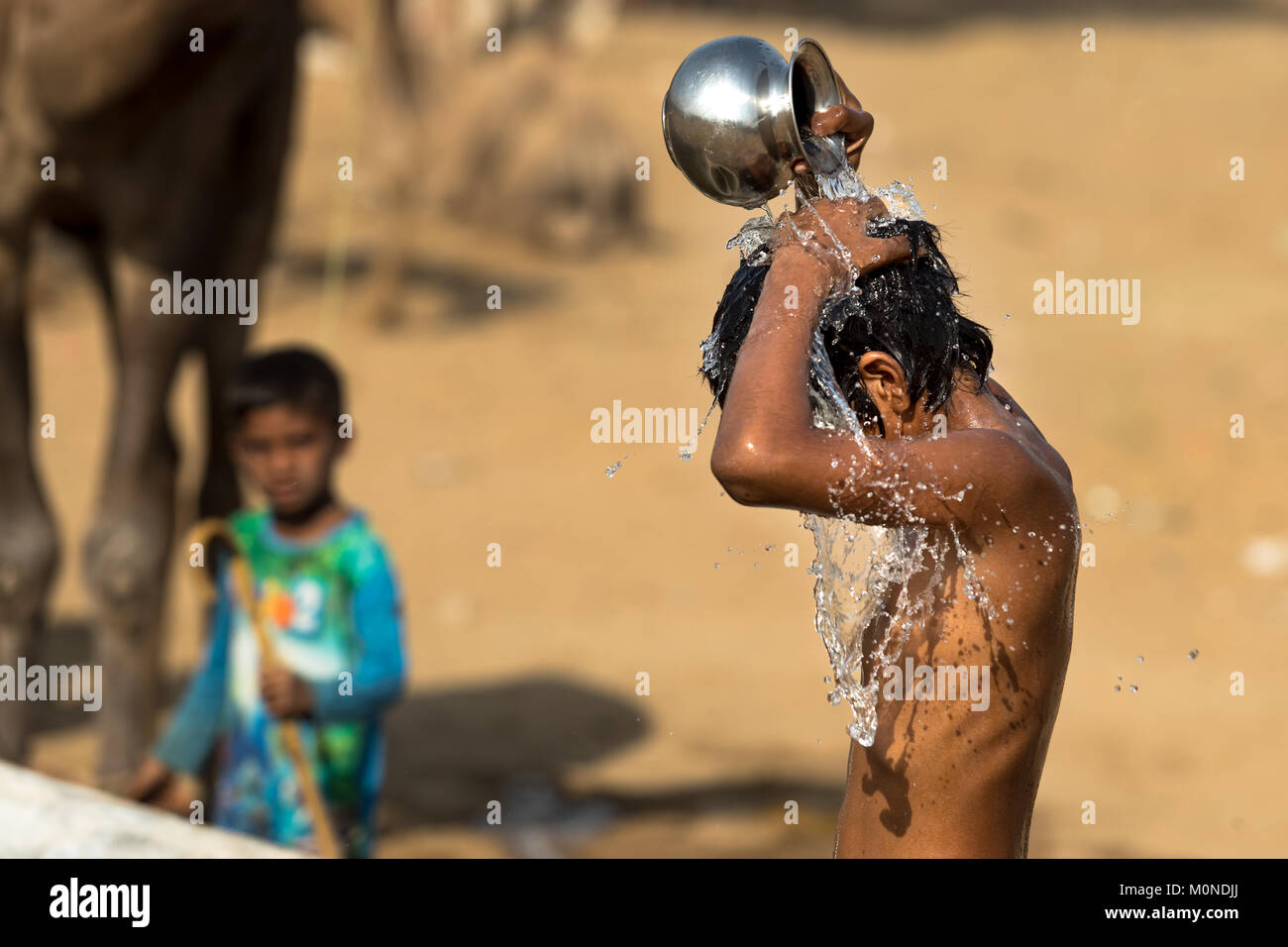 Child Pouring Water High Resolution Stock Photography and Images - Alamy