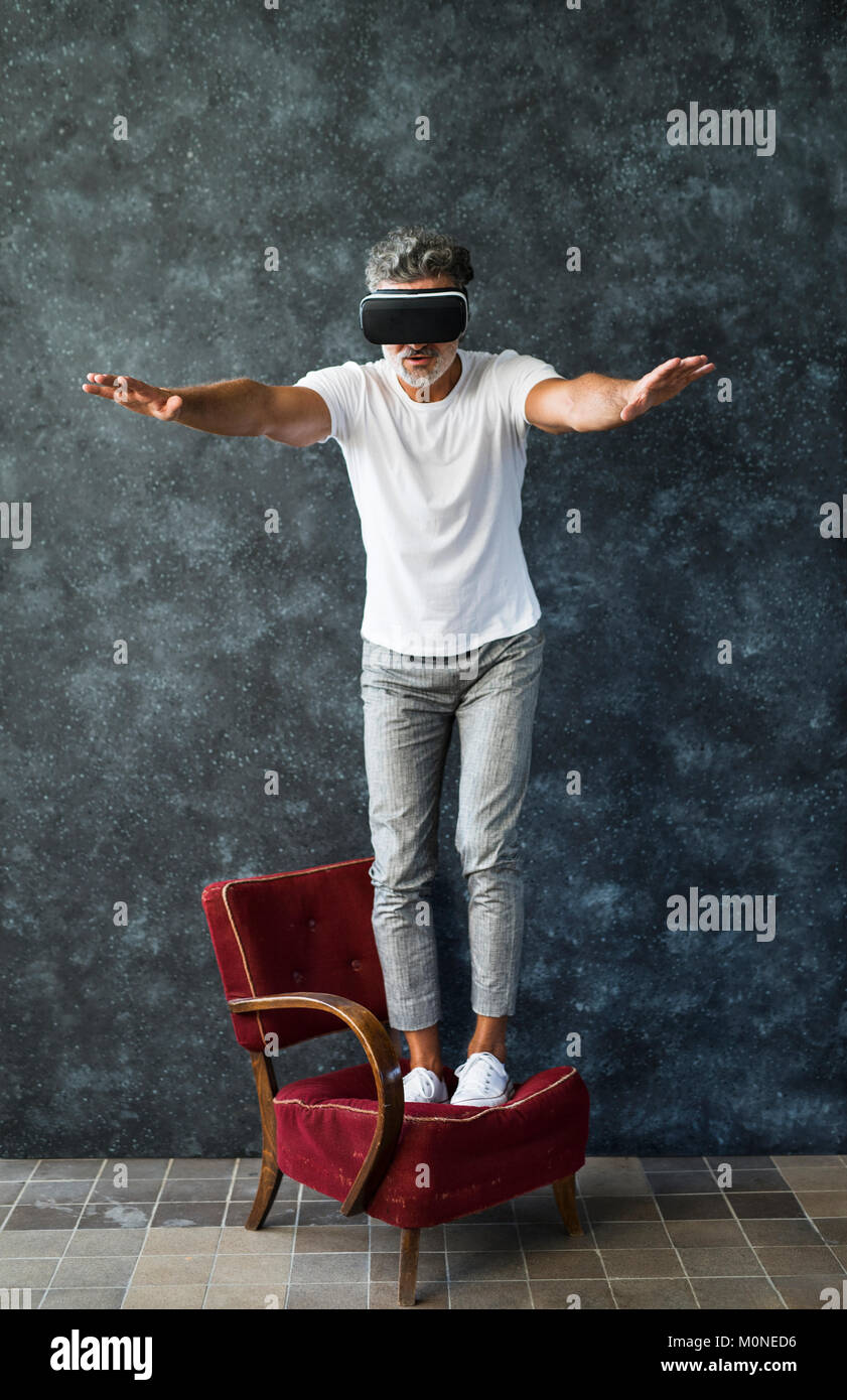 Man Balancing On Chair High Resolution Stock Photography and Images - Alamy