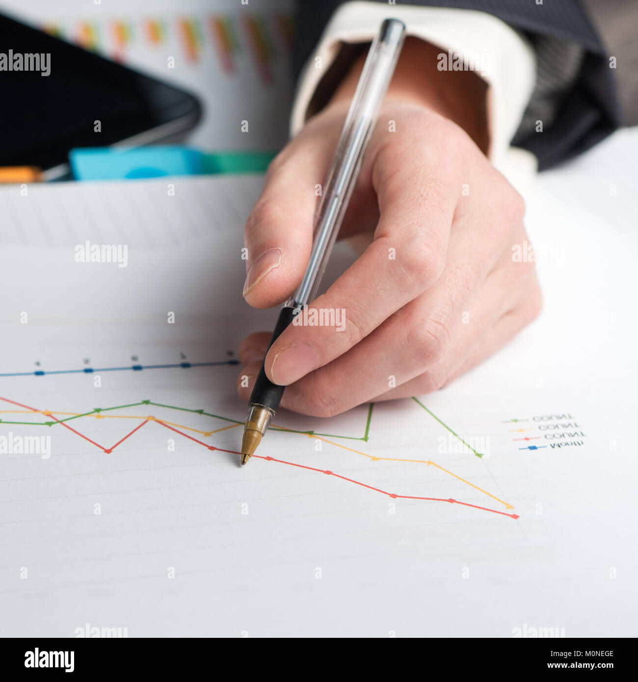 Business man checking bar chart Stock Photo - Alamy