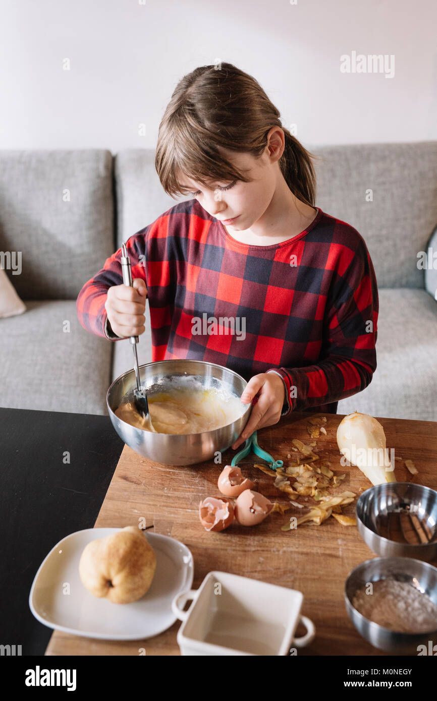 Girl preparing batter Stock Photo - Alamy