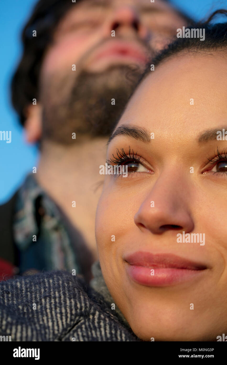 Portrait of smiling young woman looking with boyfriend outdoors Stock ...