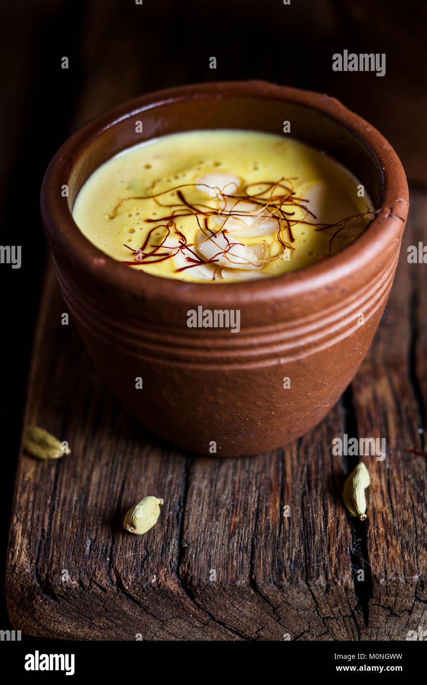 Indian saffron milk and cardamom Stock Photo - Alamy