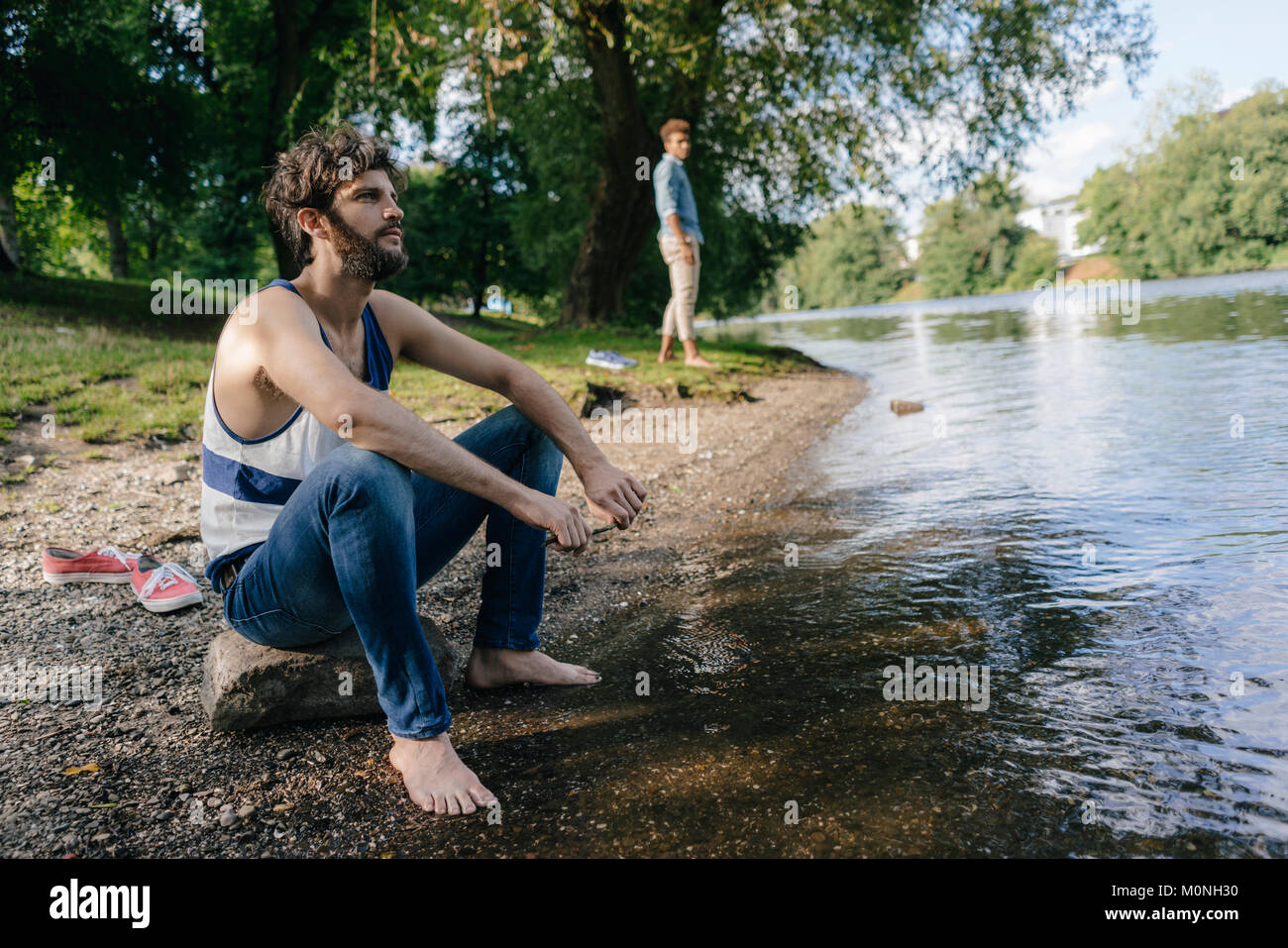 Man relaxing at the water Stock Photo - Alamy