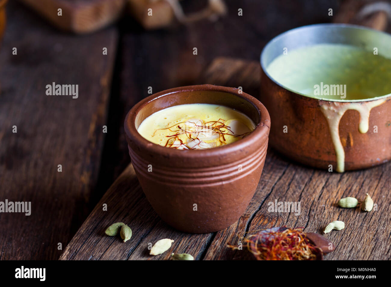 Indian saffron milk and cardamom Stock Photo - Alamy