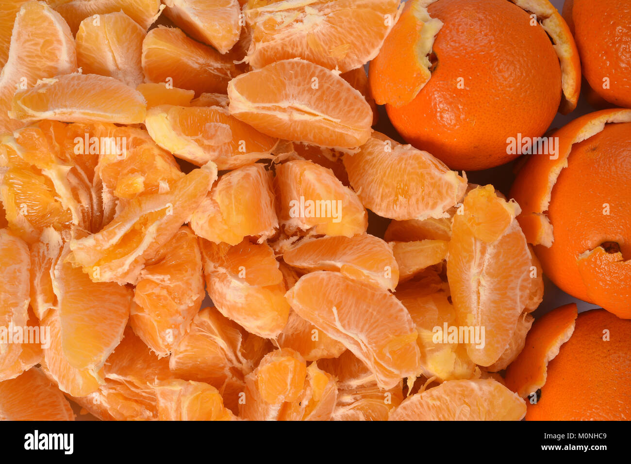 Orange design background from the cleared lobules fresh oranges, on the ...