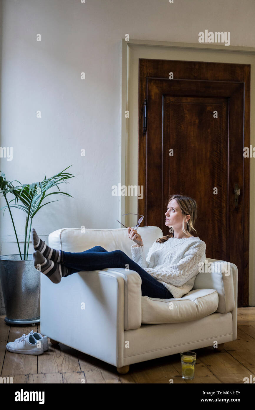 Serious blond woman full length home hi-res stock photography and ...