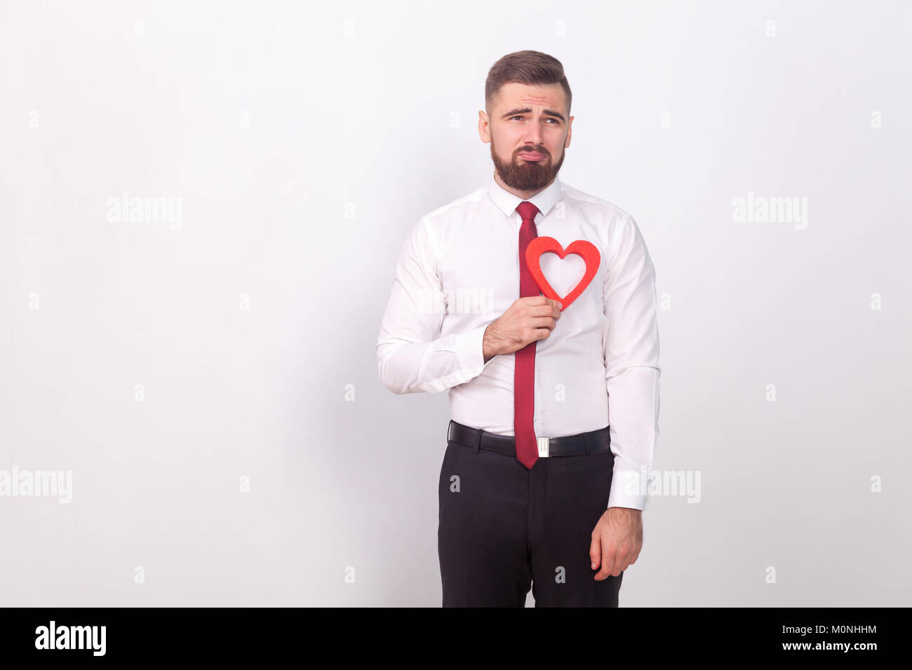 Dramatic lost of love. Man cry, because broken heart. Indoor, studio ...