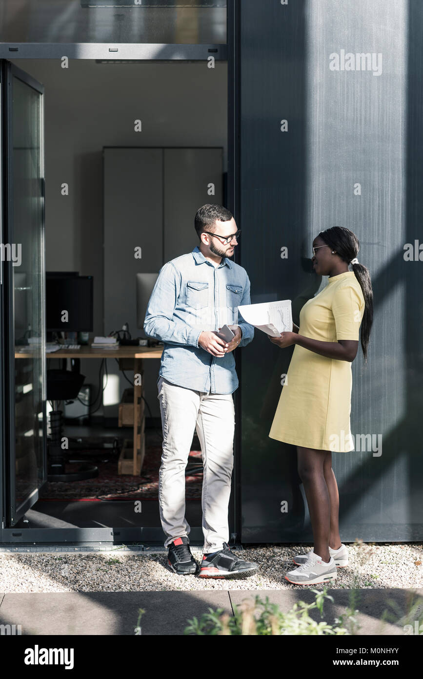 Colleagues working together outside the office Stock Photo - Alamy