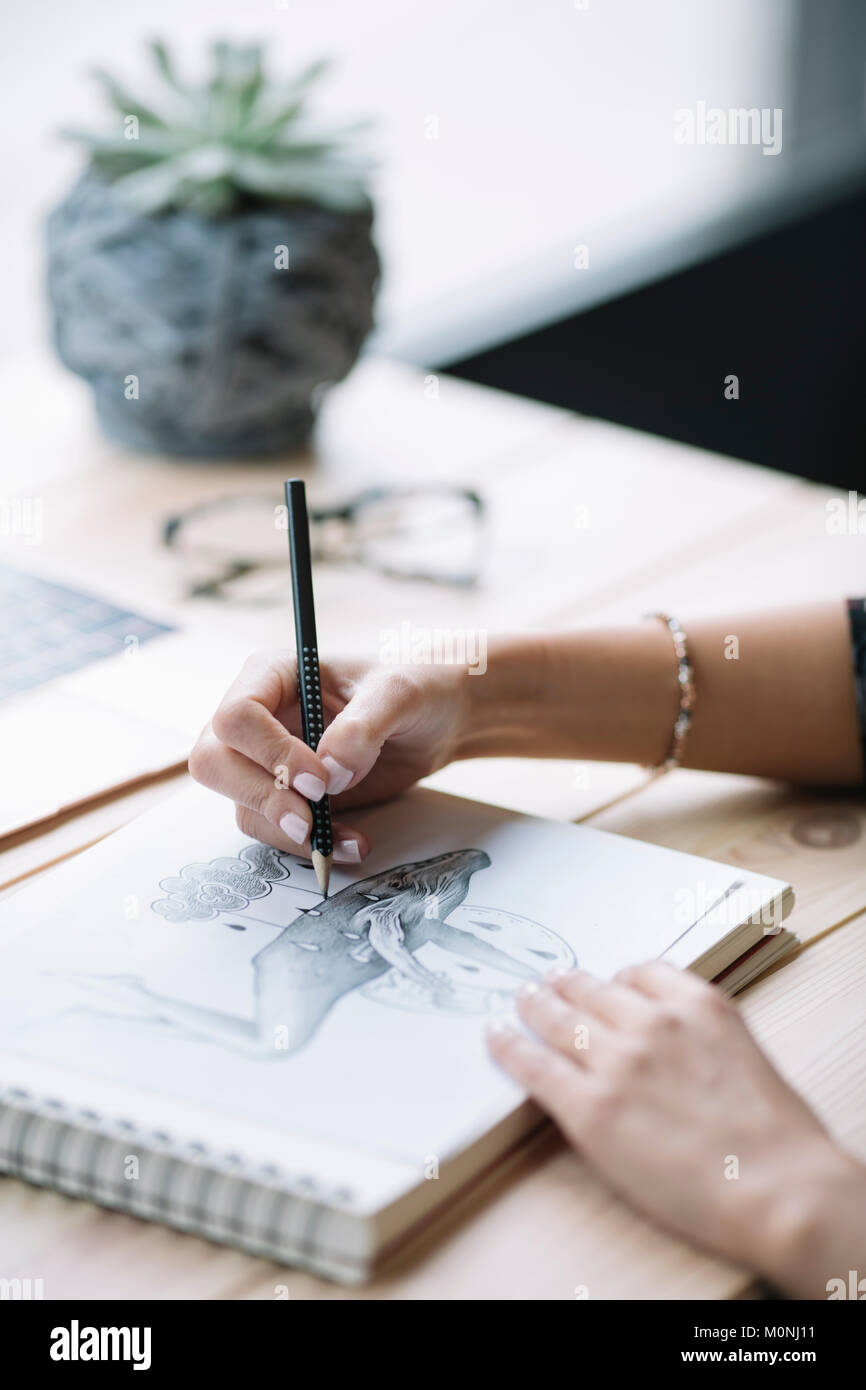 Woman's hand drawing, close-up Stock Photo - Alamy