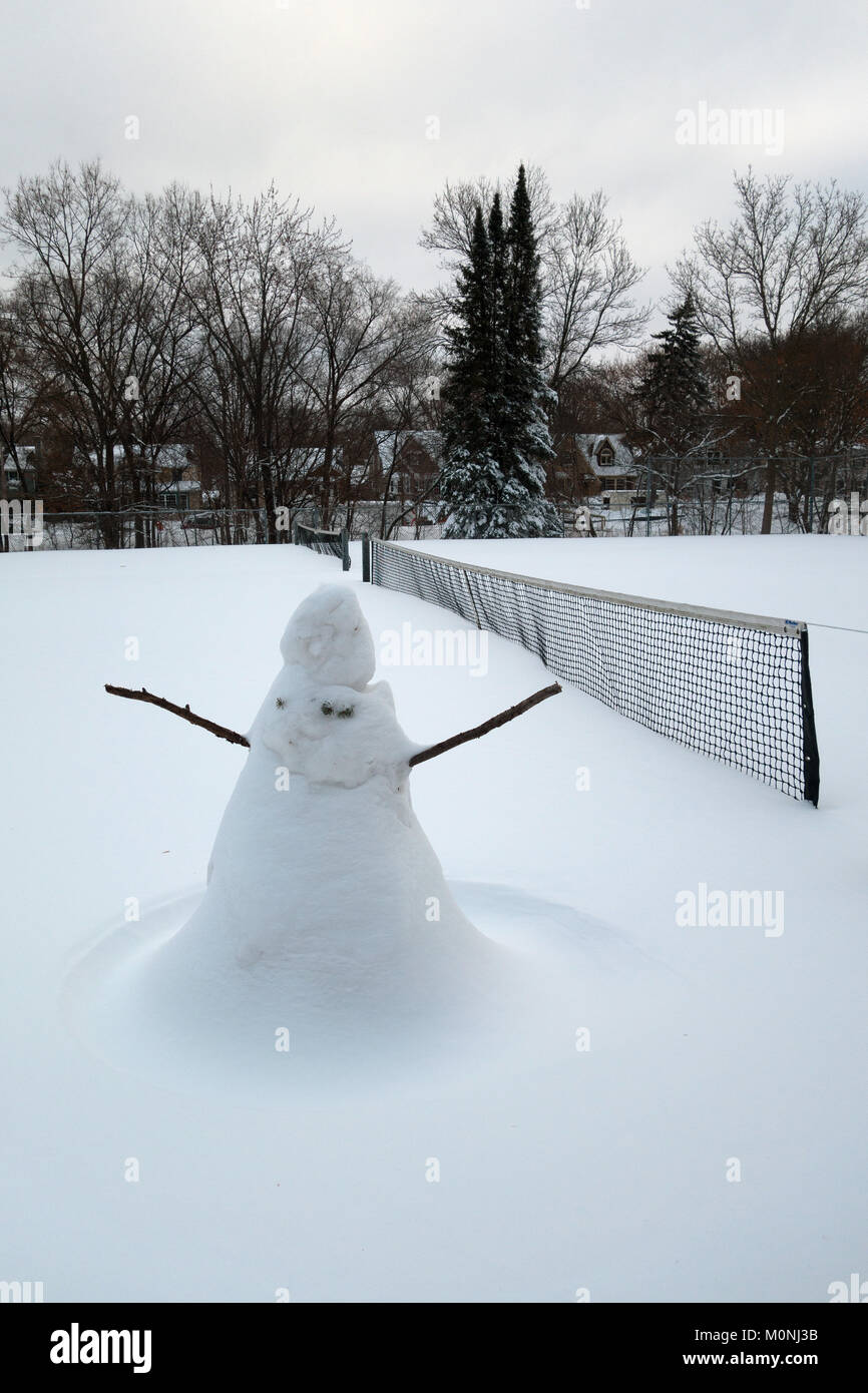 A snowman built next to a tennis court after a blizzard in Minneapolis ...