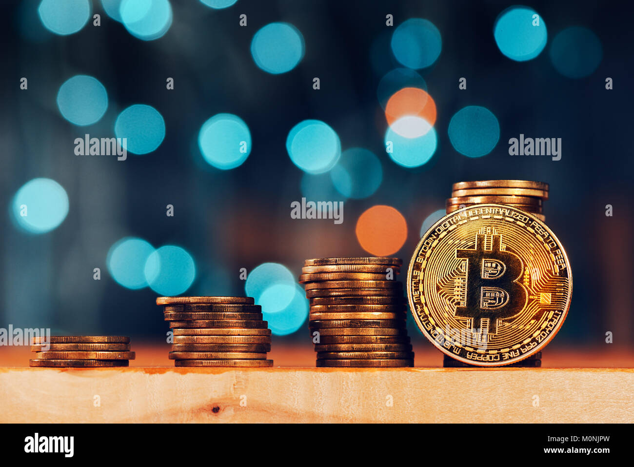 Stacked bitcoin columns, golden colored coins for BTC cryptocurrency ...